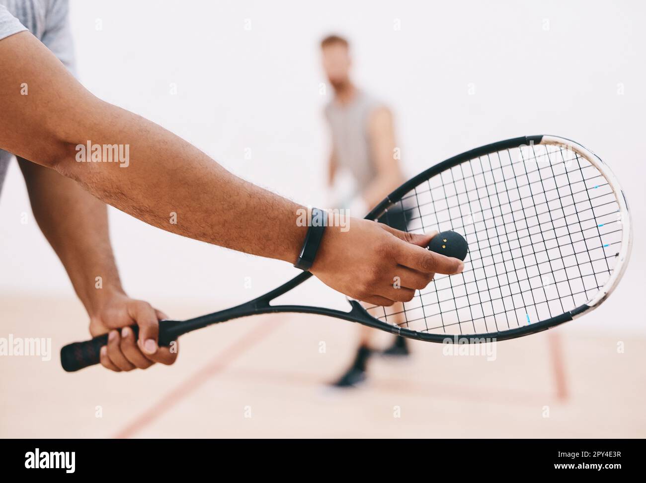Time to show this ball whos boss. a man serving a ball with a racket ...