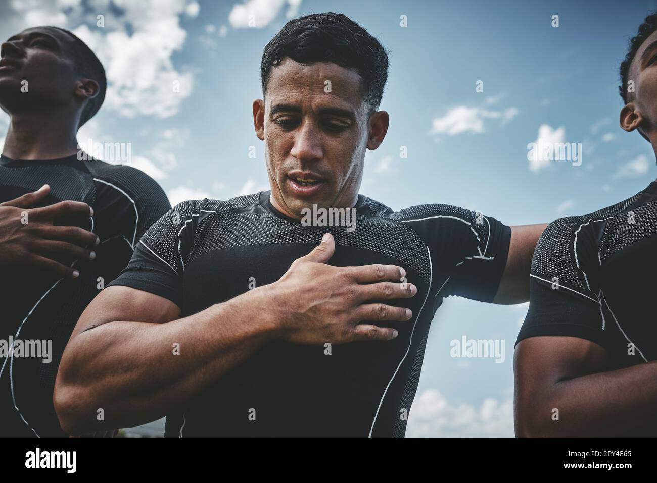 The emotions run deep. a team of confident young rugby players standing ...