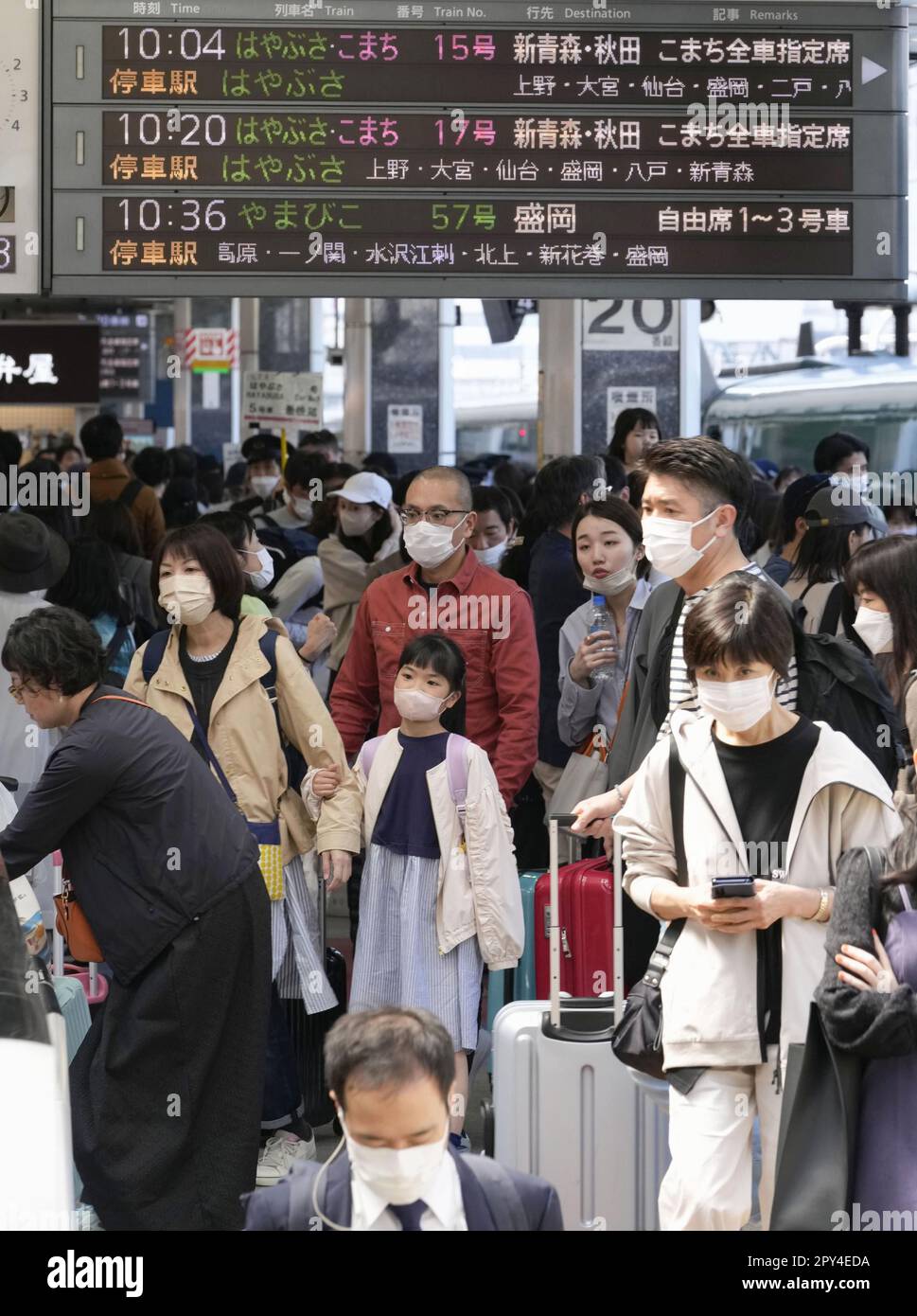 A shinkansen bullet train platform at JR Tokyo Station is crowded with passengers as Japan ...