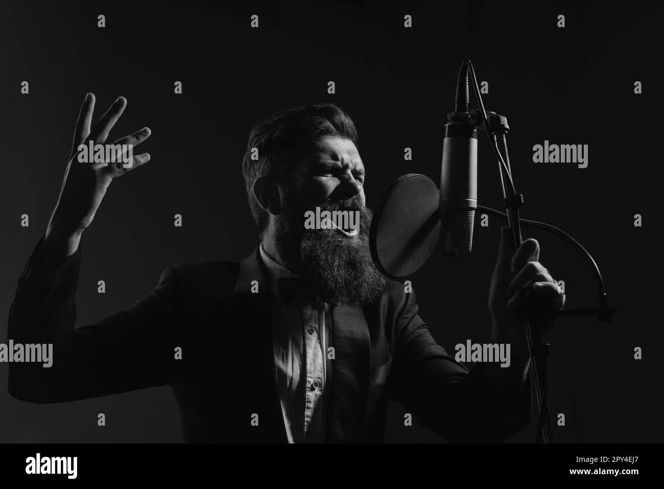 Singer gestures with hands. Man singing with music microphone Stock ...