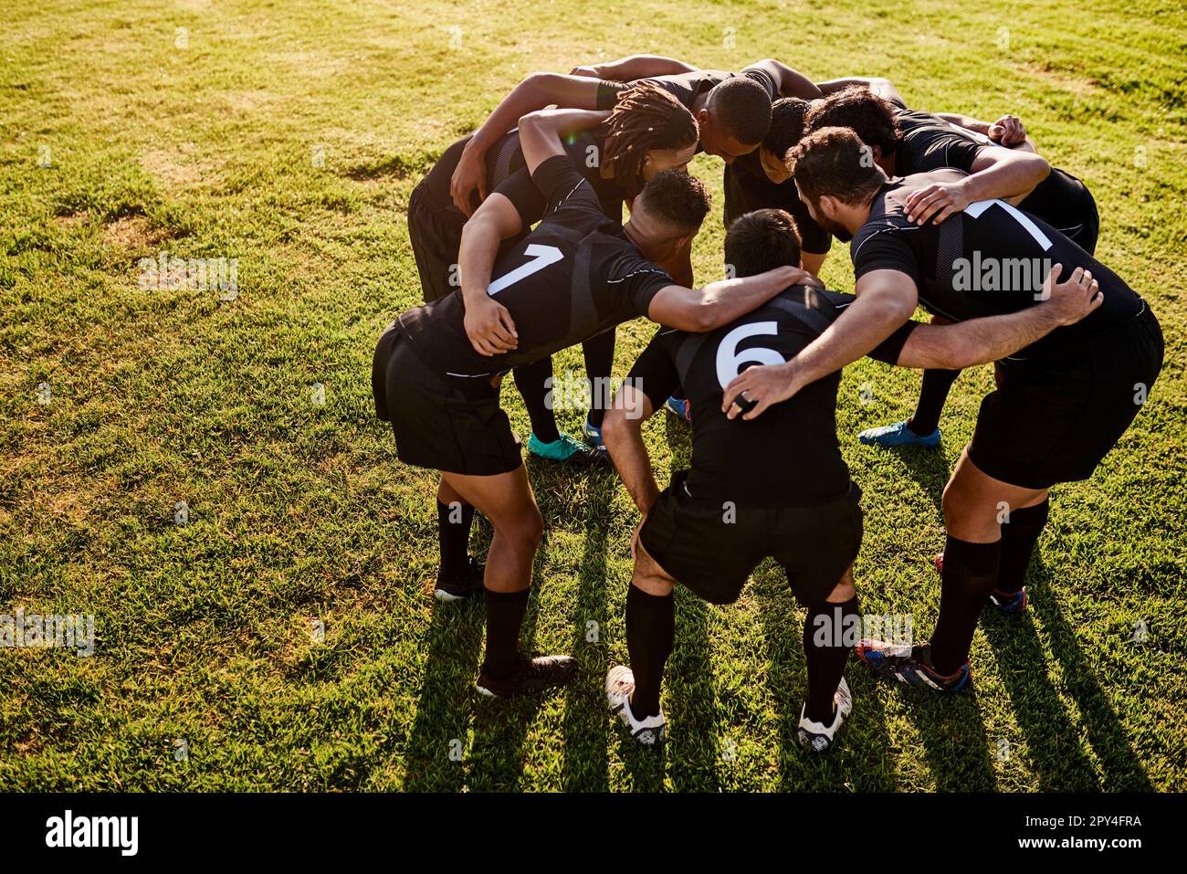 Building team morale. Full length shot of a diverse group of sportsmen ...