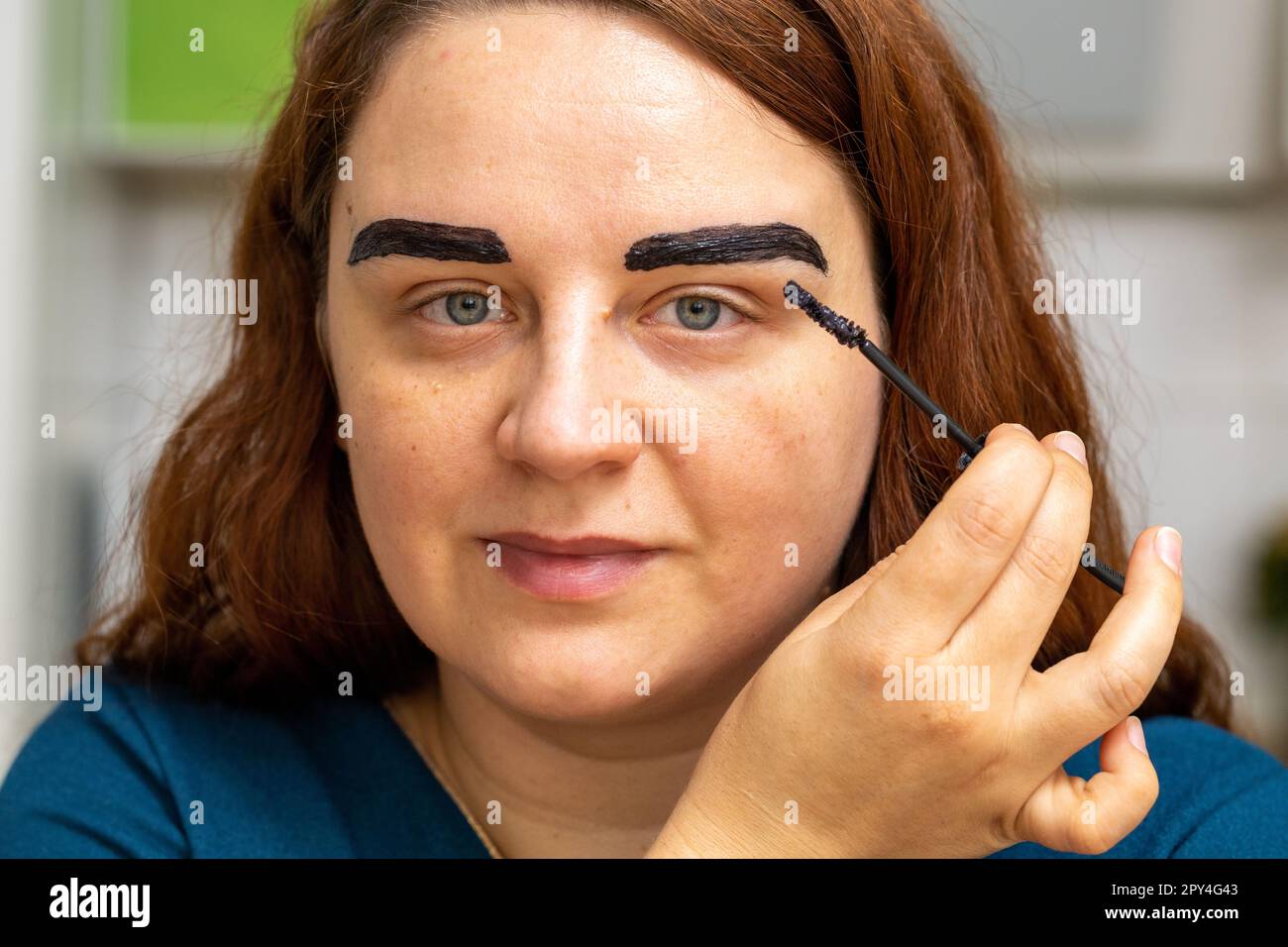 Portrait of woman waiting time washing off the eyebrow's dye having ...
