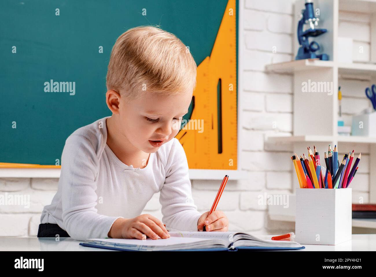 Kid gets ready for school. Cute little preschool kid boy with teacher ...