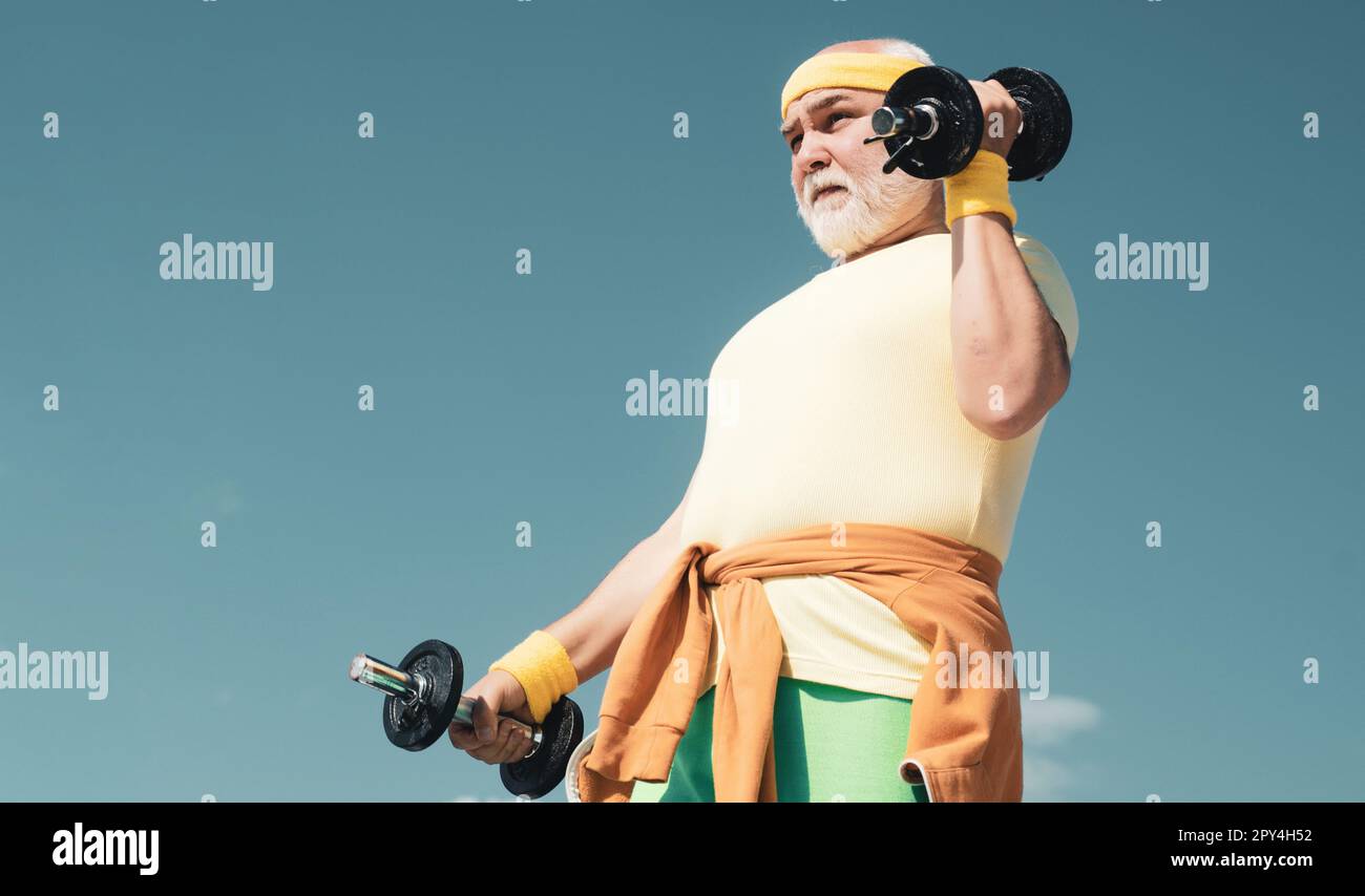 Senior male is enjoying sporty lifestyle. Old mature man exercising ...