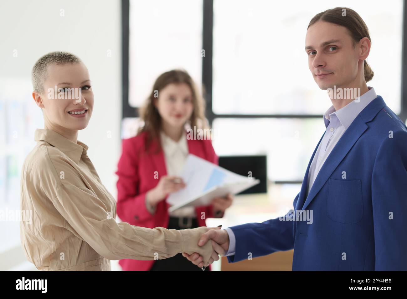 Satisfied partners shake hands hi-res stock photography and images - Alamy