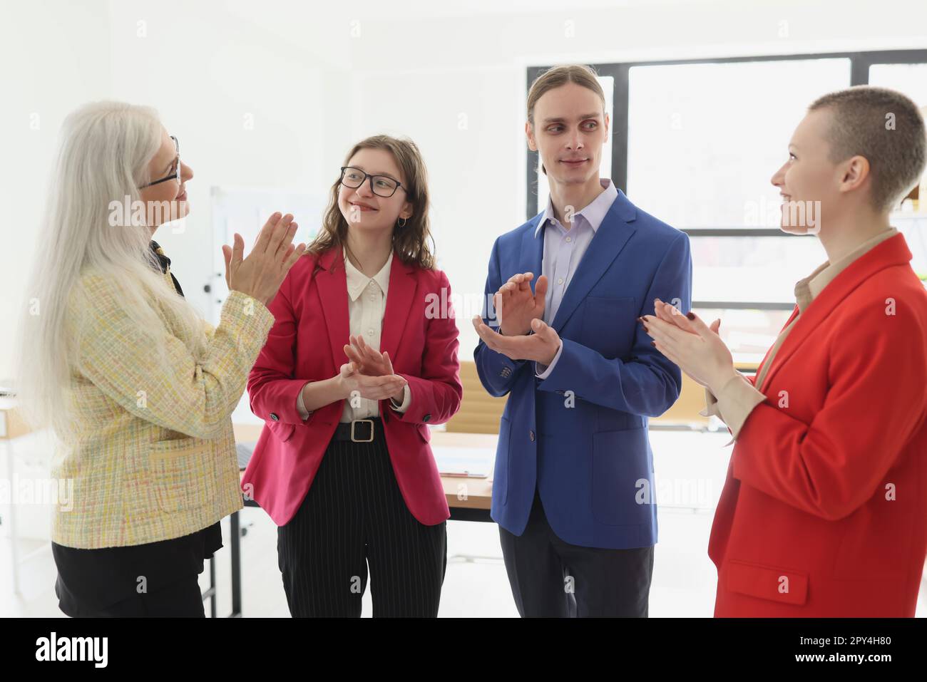Happy colleagues clap hands celebrating success of project Stock Photo ...