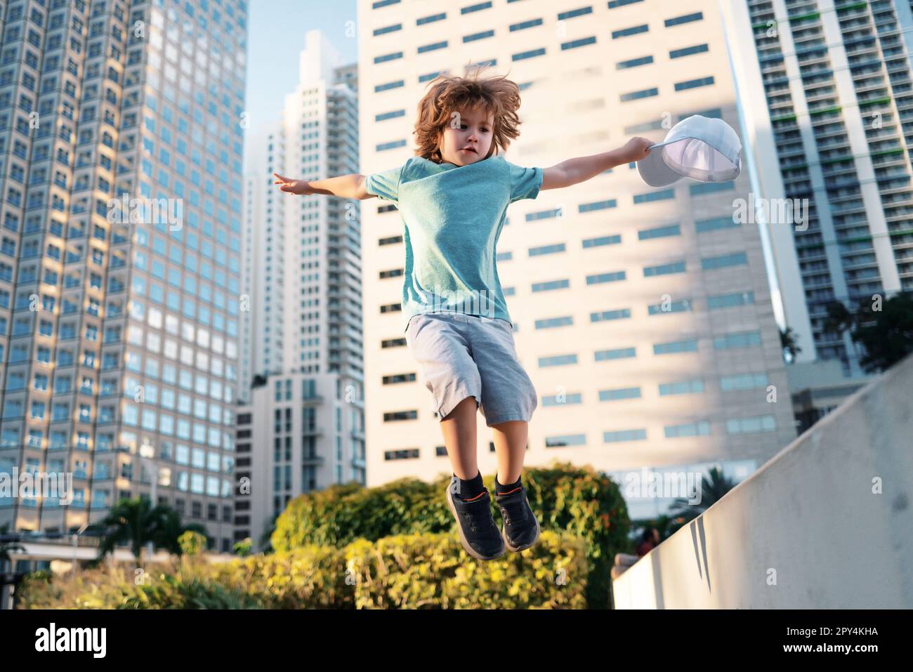 Future city concept. Child and modern buildings. Kid in town skyscraper ...