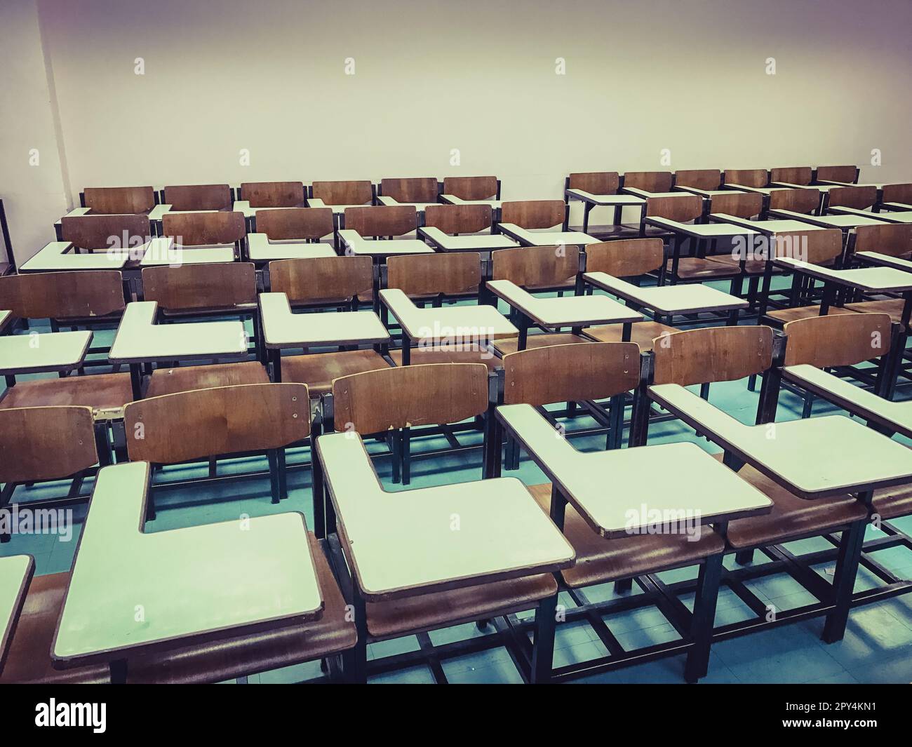 Wooden chairs in the classroom background Stock Photo - Alamy