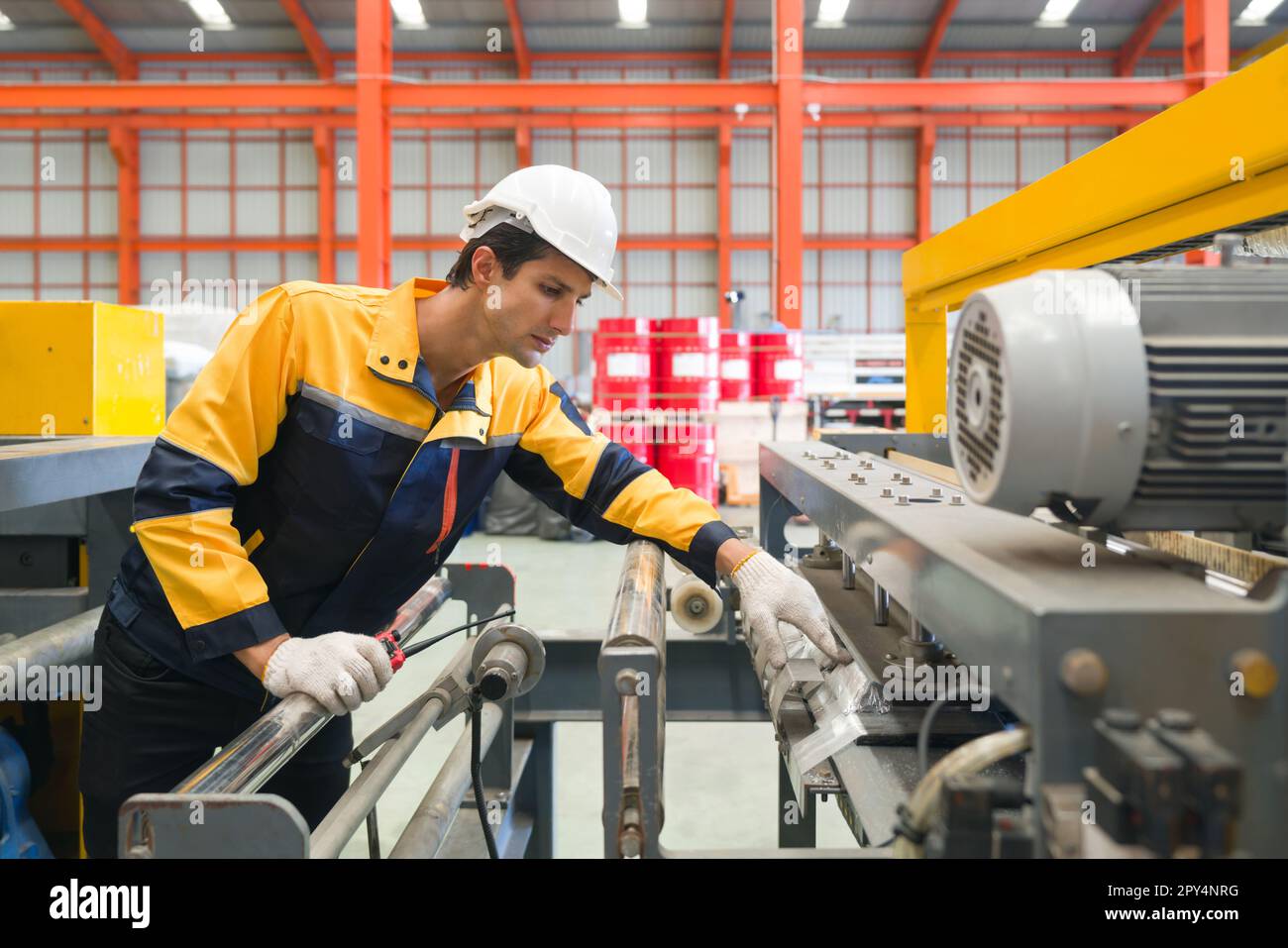 Young hispanic labor dressed in polyester jacket uniform, hardhat and ...