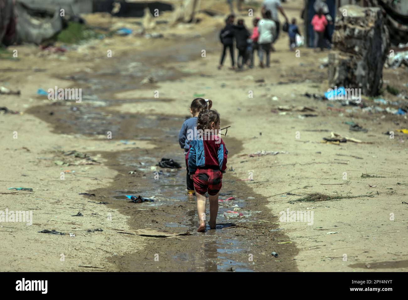 Palestinian children play in front of their family's homes in the town ...