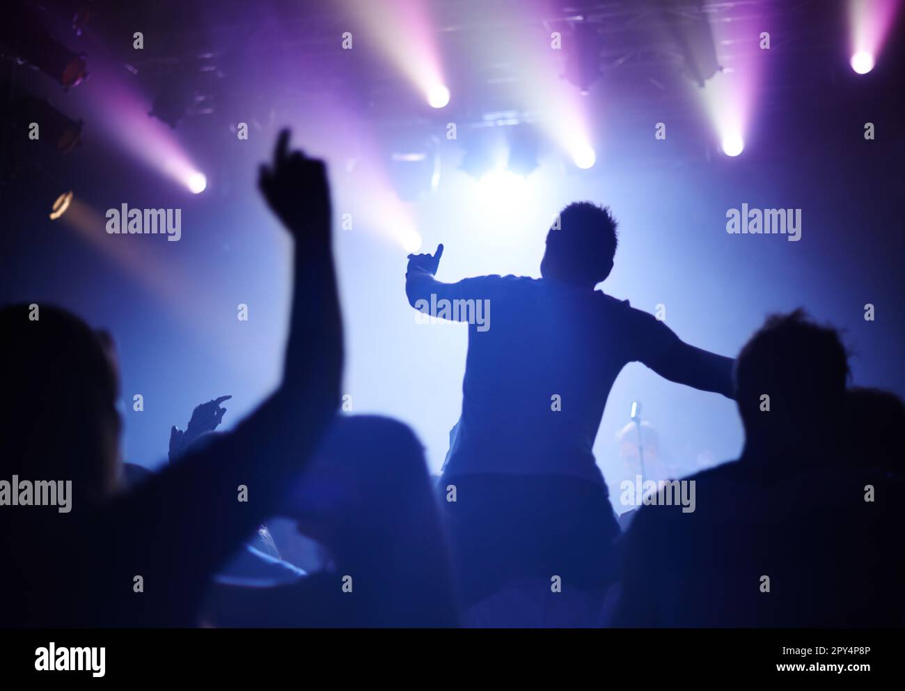 Rock concert, dance and party crowd with disco lighting and people back ...