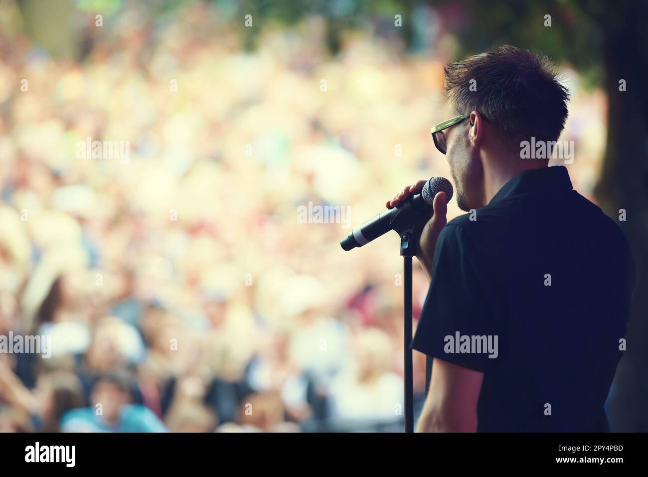Music, microphone and concert with man at festival for rock ...