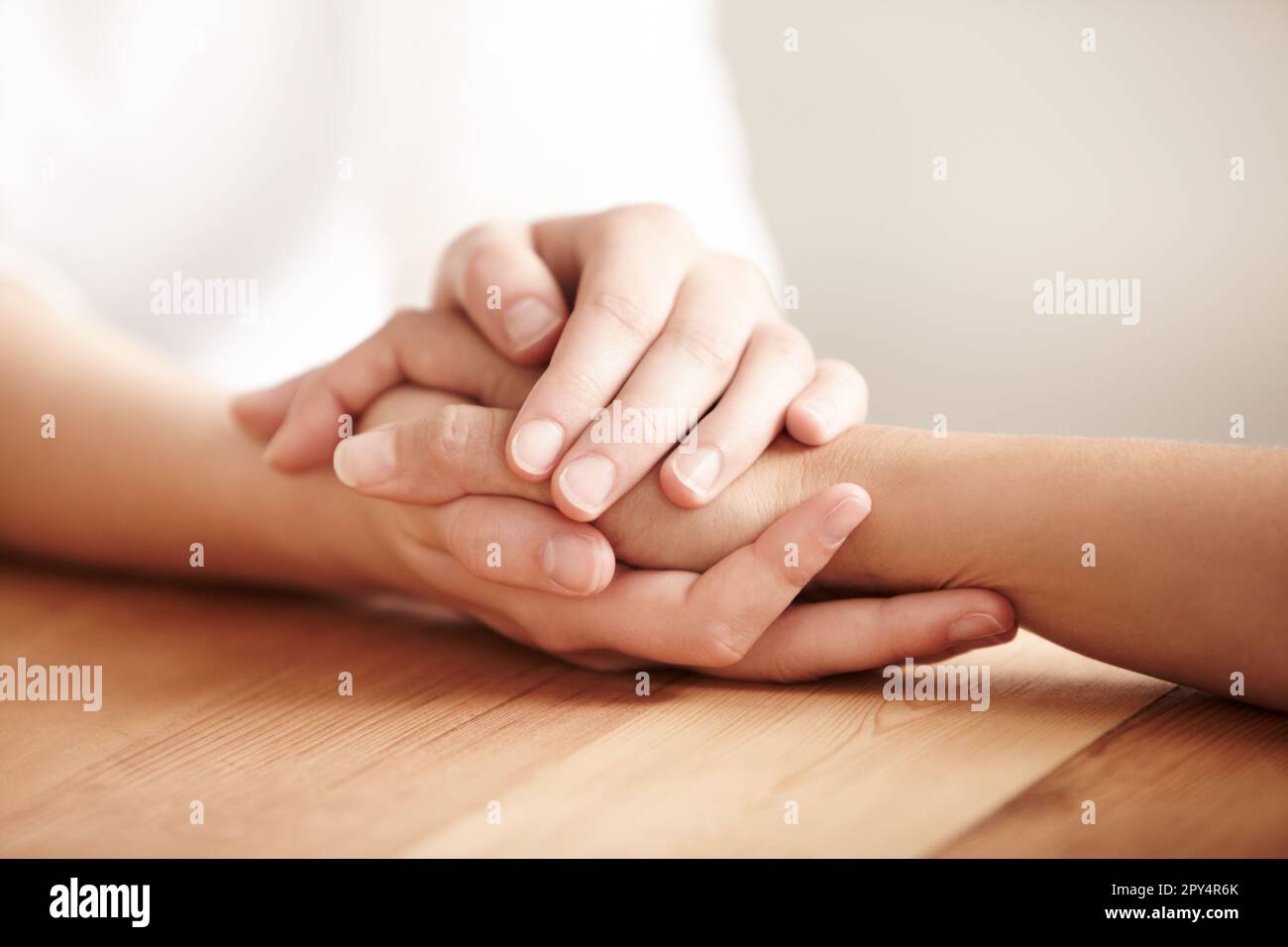 Holding hands, support and people with care for friends, showing ...