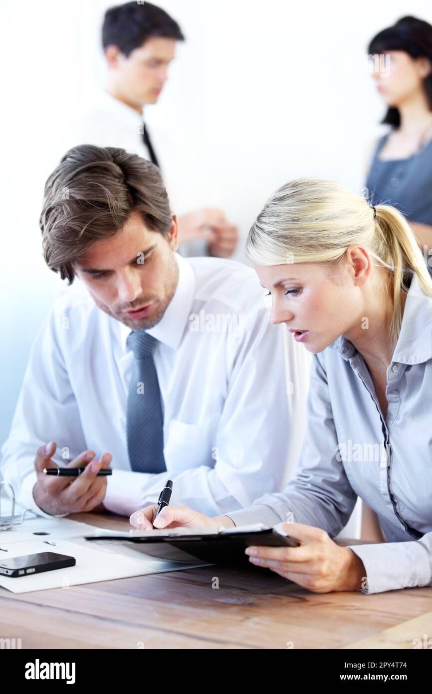 Collaboration, writing or documents with a business team in a boardroom ...