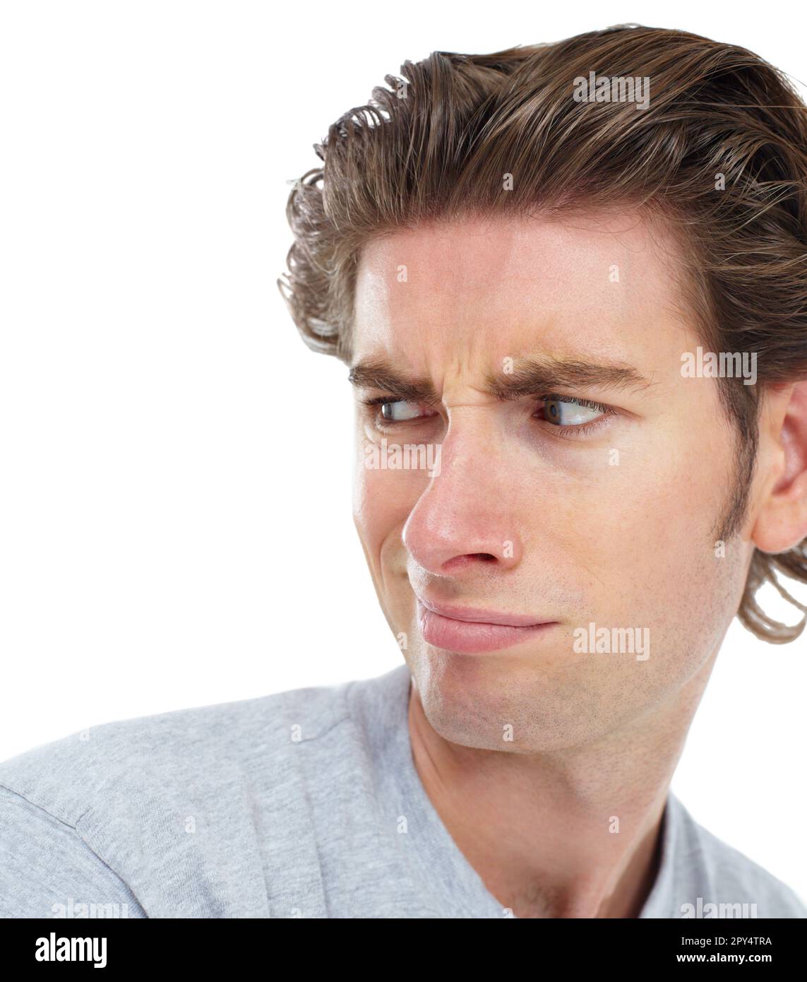 Young man, disgust and face looking over shoulder with anger, confused ...