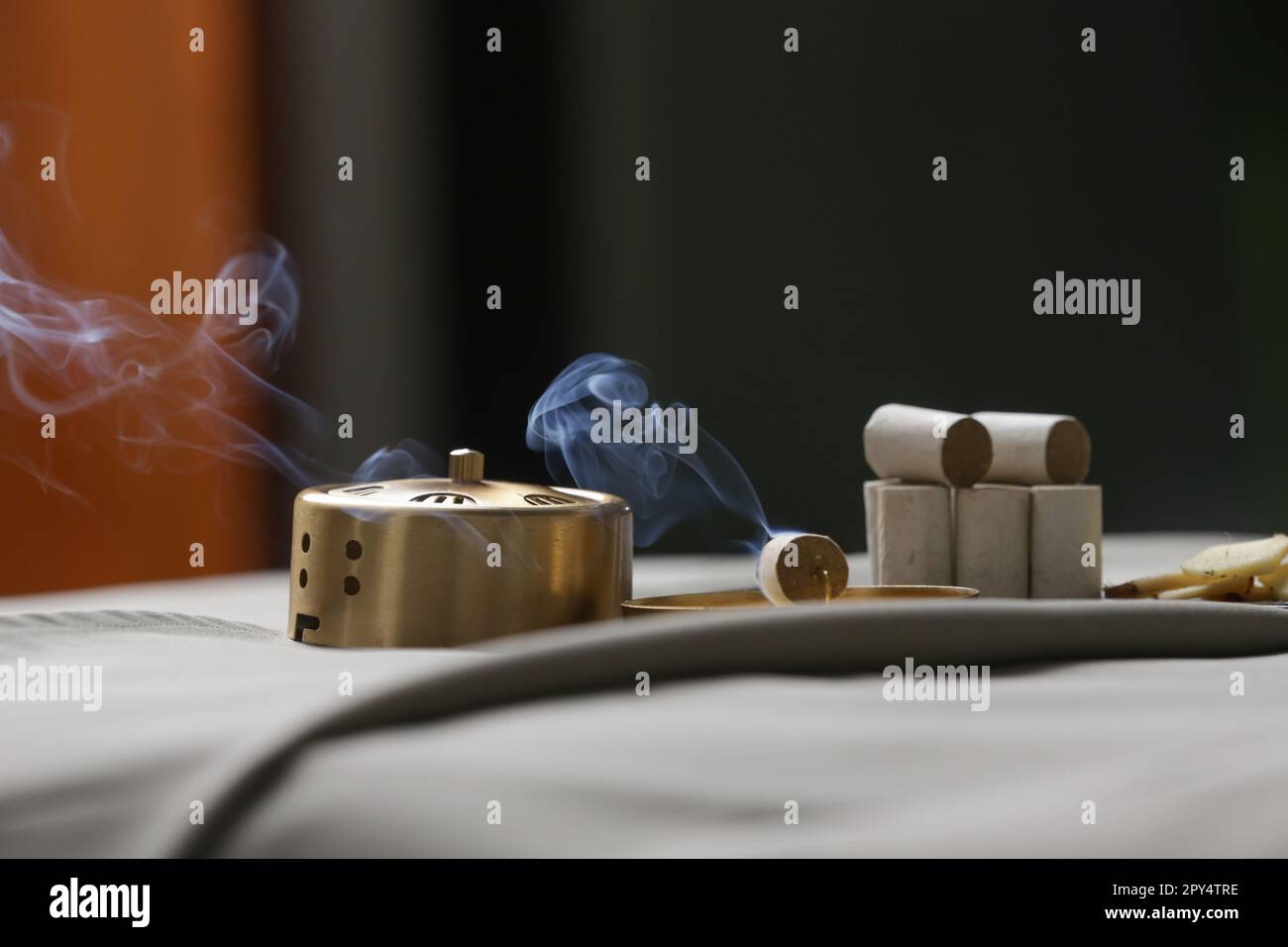 Moxibustion treatment - traditional Chinese medicine tools for acupuncture points heating ...