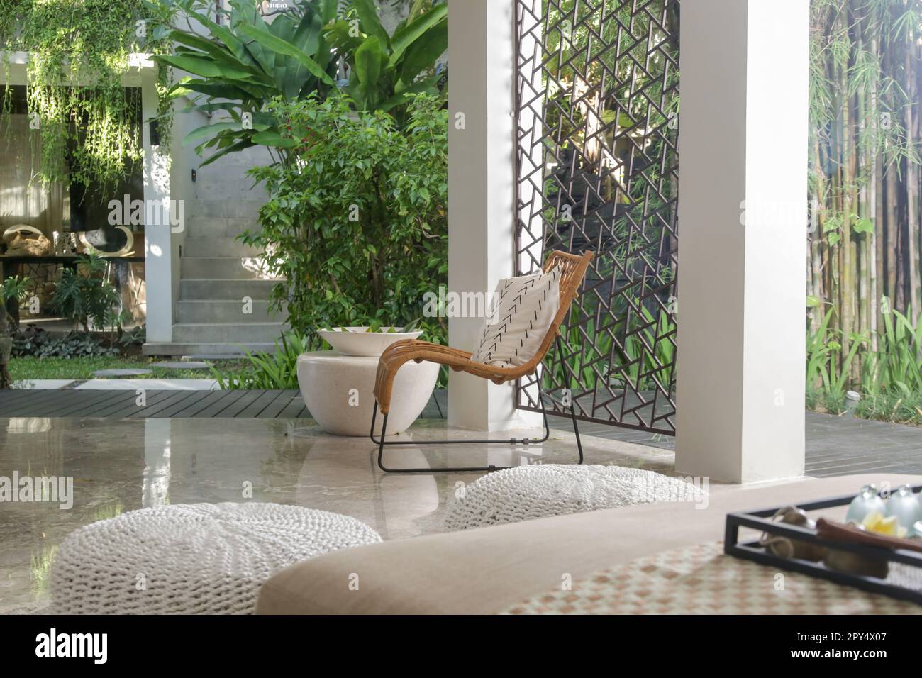 Half opened lounge area with all natural materials made furniture ...