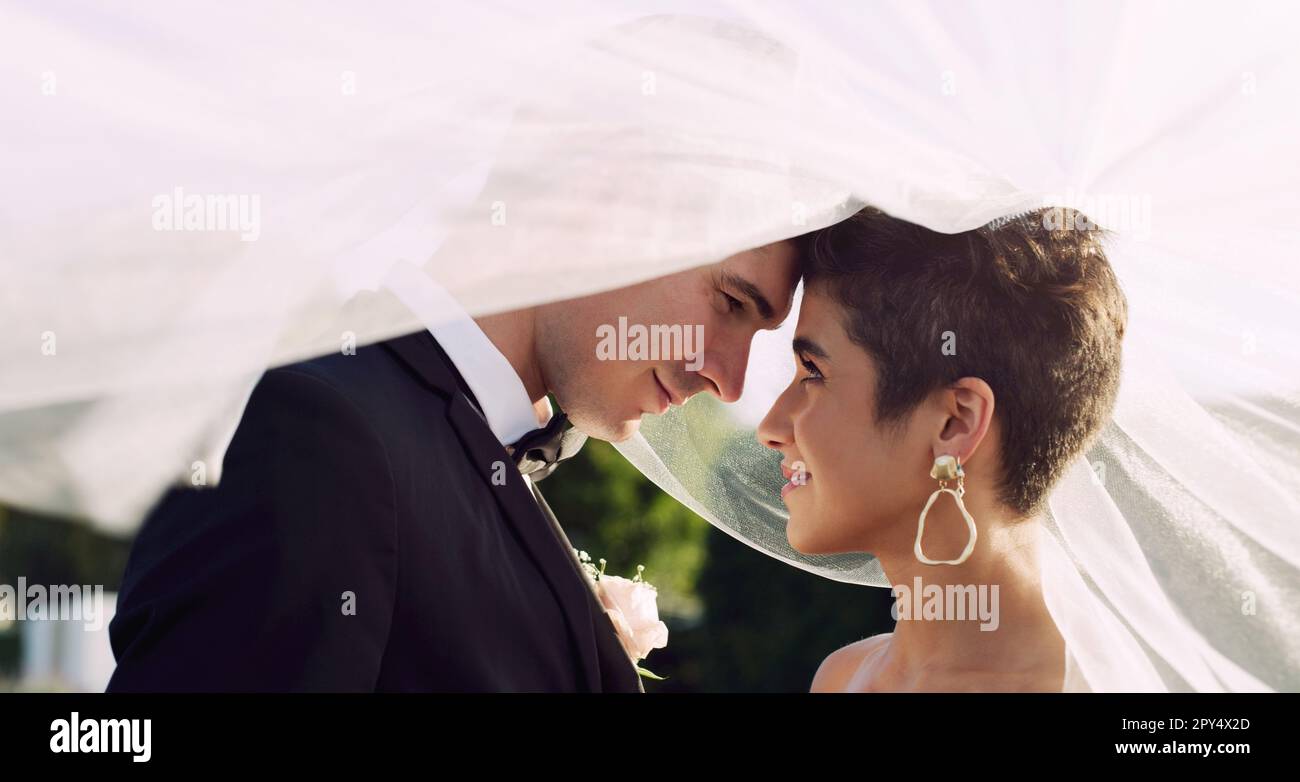 This moment is just so perfect. an affectionate young newlywed couple ...