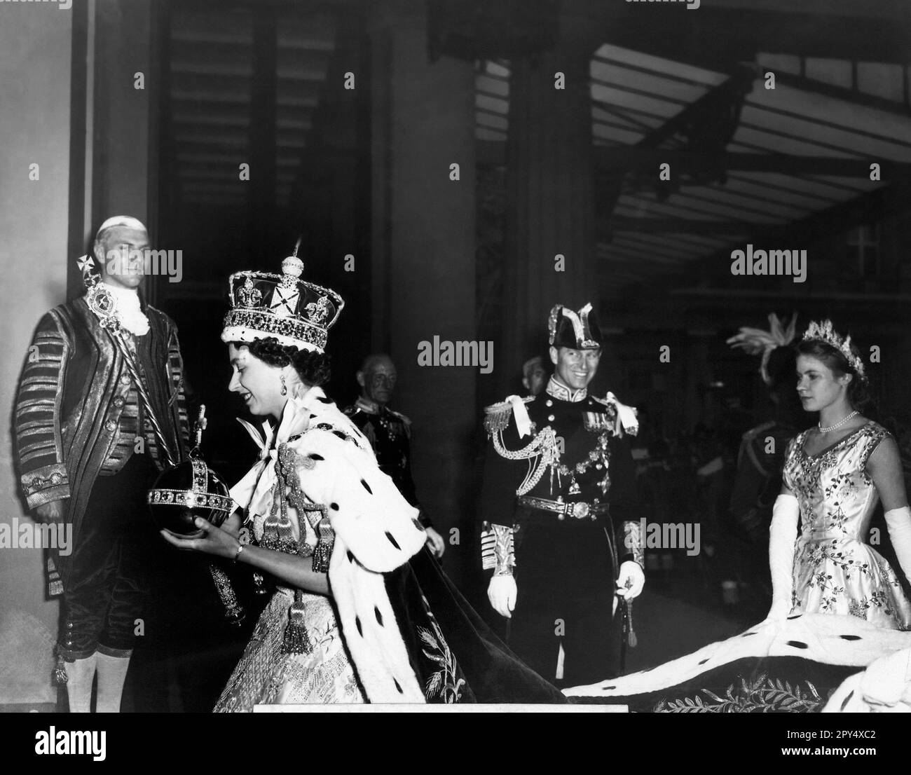 FILE - Britain's Queen Elizabeth II, carrying the orb and the scepter ...