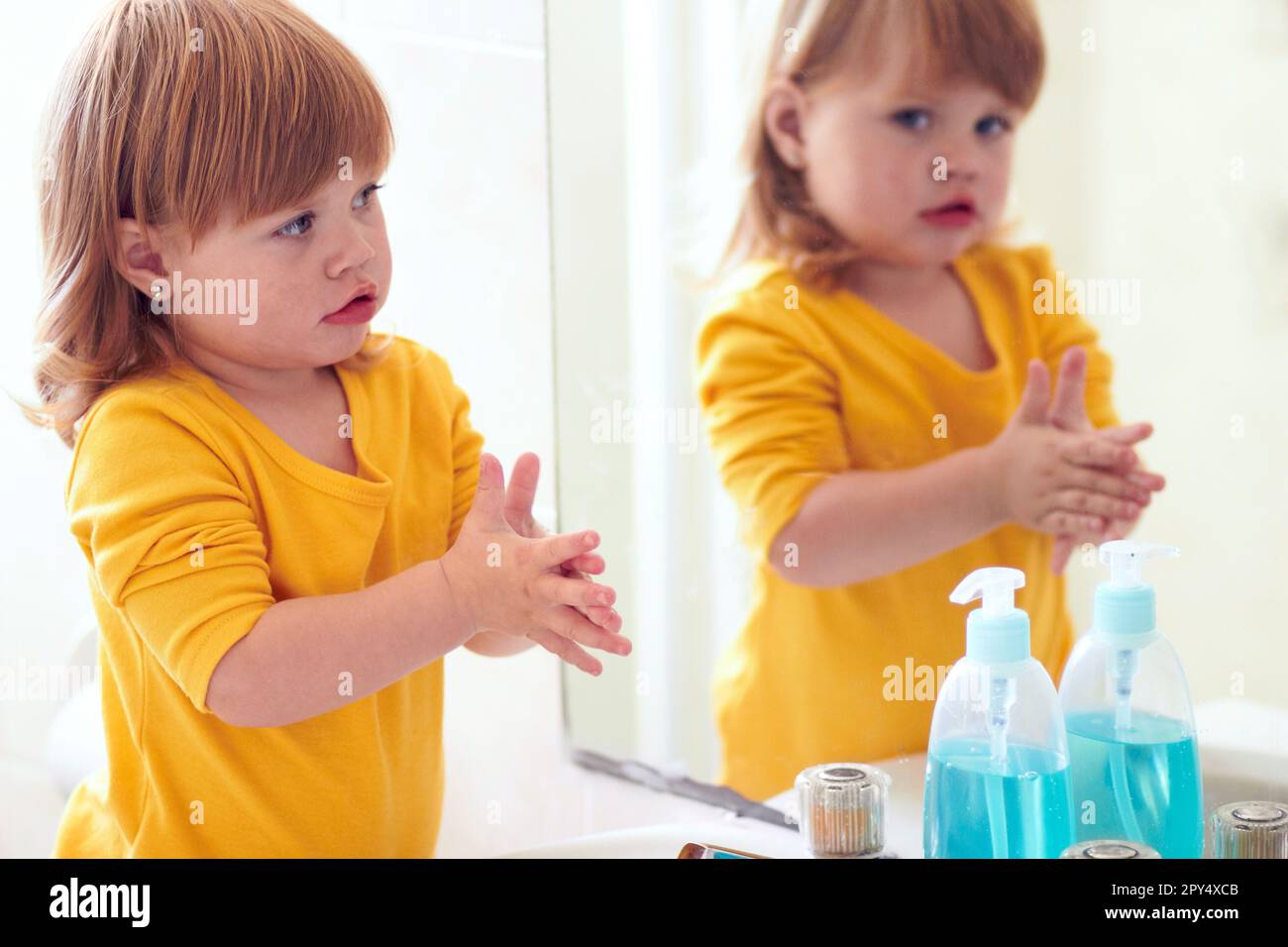 Cleaning, hygiene and washing hands with little girl in bathroom for ...