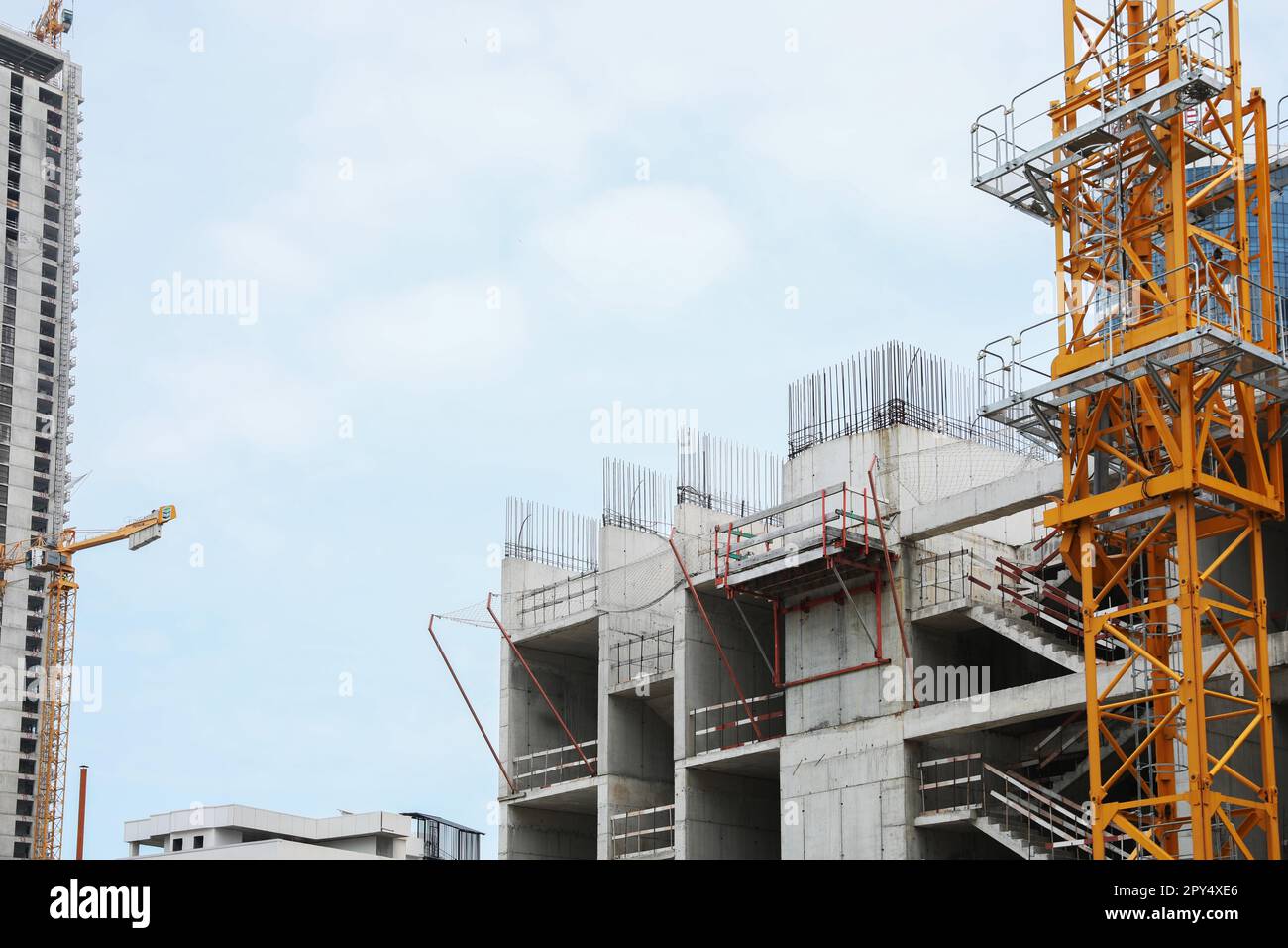 Construction site with tower crane near unfinished building Stock Photo ...