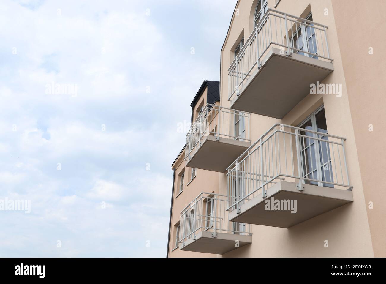 Exterior of beautiful building with empty balconies. Space for text ...