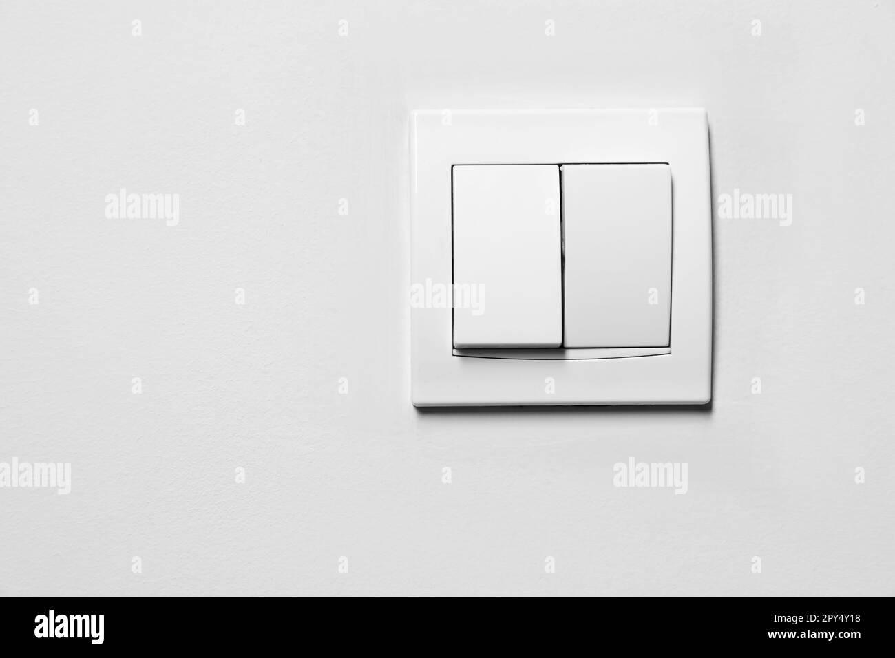 Modern plastic light switch on white wall, space for text Stock Photo ...