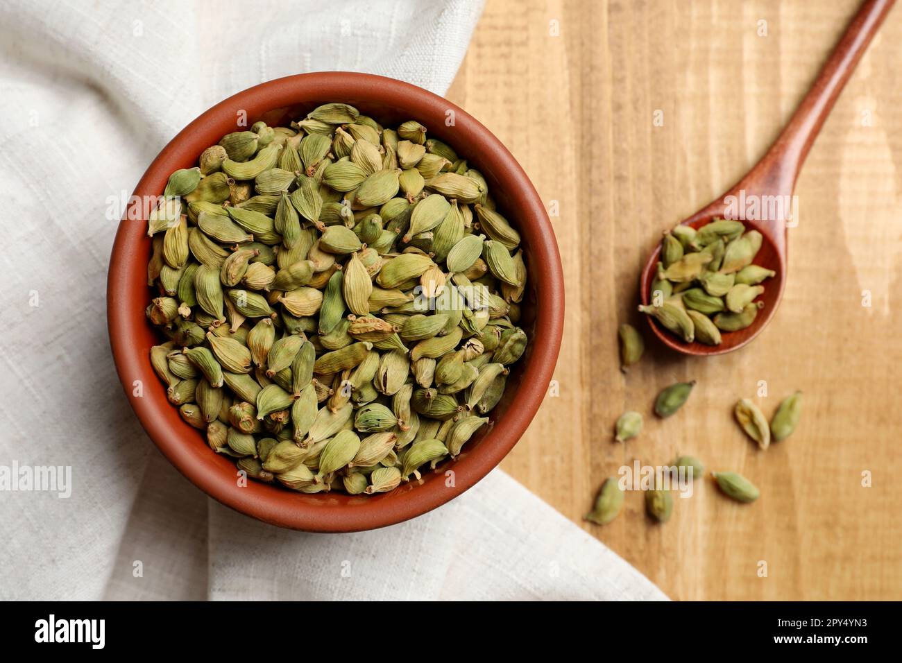 Dry cardamom pods on wooden table, flat lay Stock Photo - Alamy