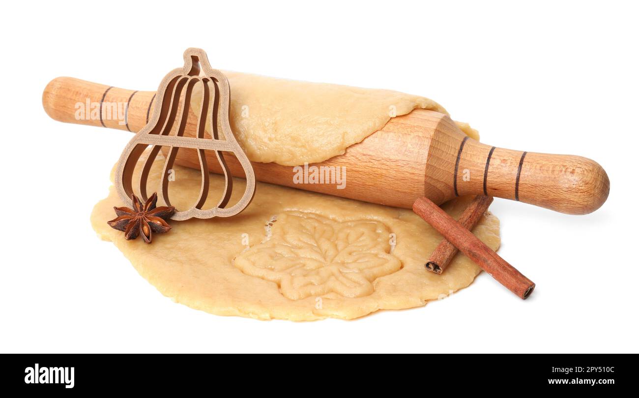 Cookie cutter, dough, spices and rolling pin on white background Stock ...