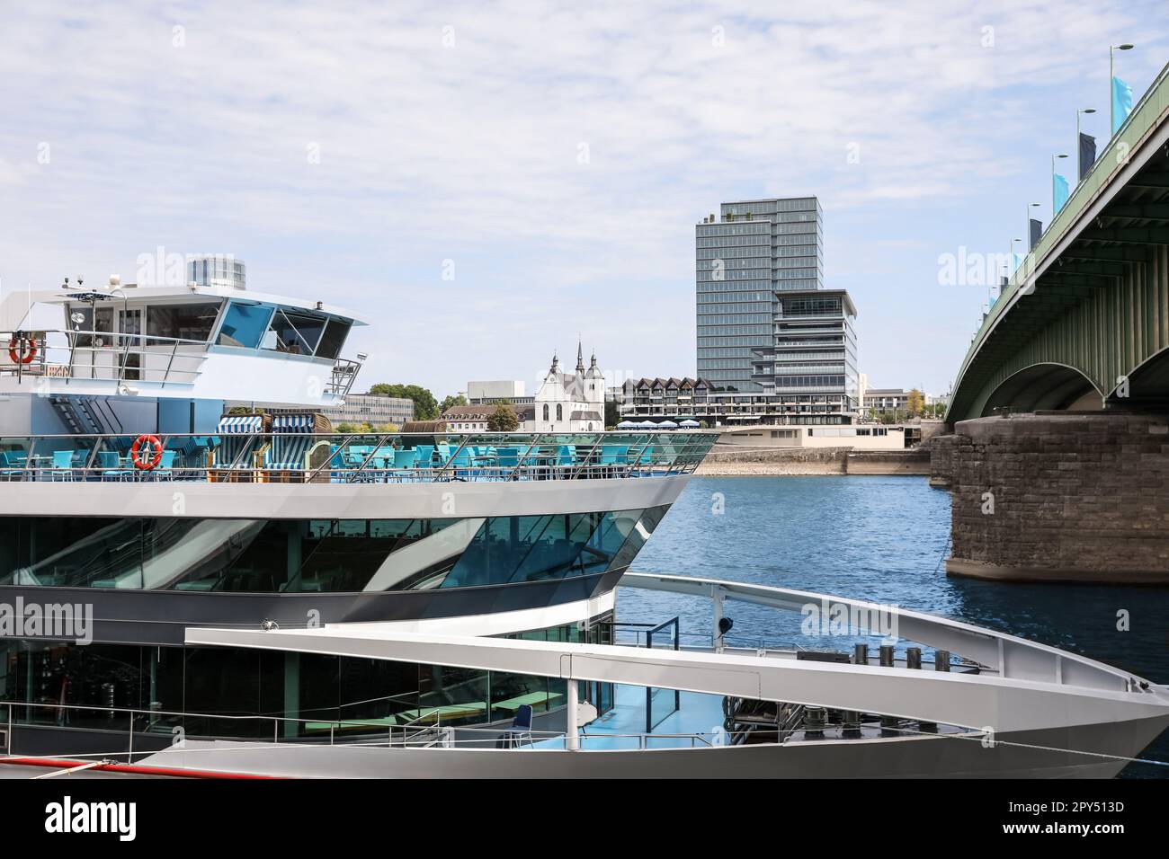 Modern ferry ship near bridge on sunny day Stock Photo - Alamy