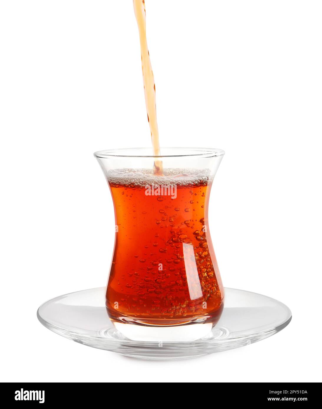 Pouring traditional Turkish tea into glass on white background Stock ...