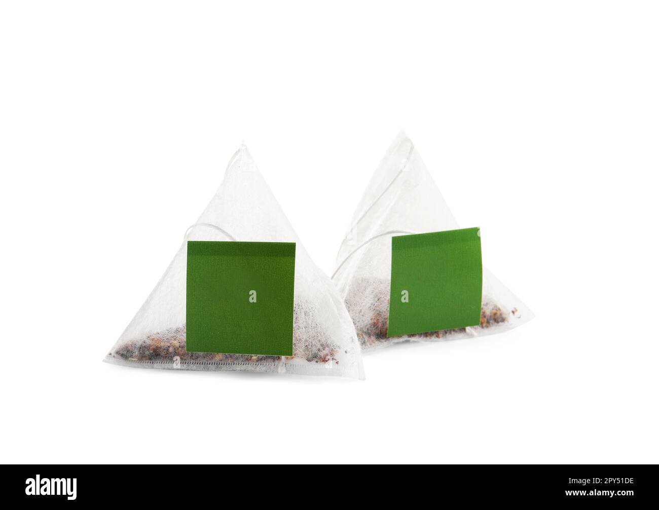 New pyramid tea bags on white background Stock Photo - Alamy