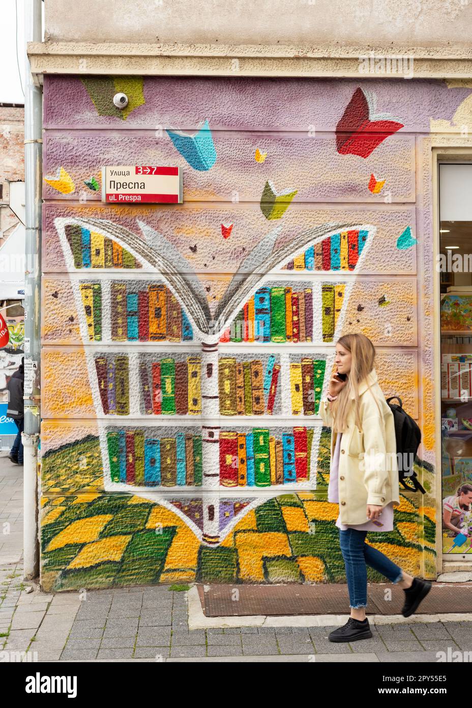 Street art mural Vivid colourful graffiti painting on bookshop wall in ...