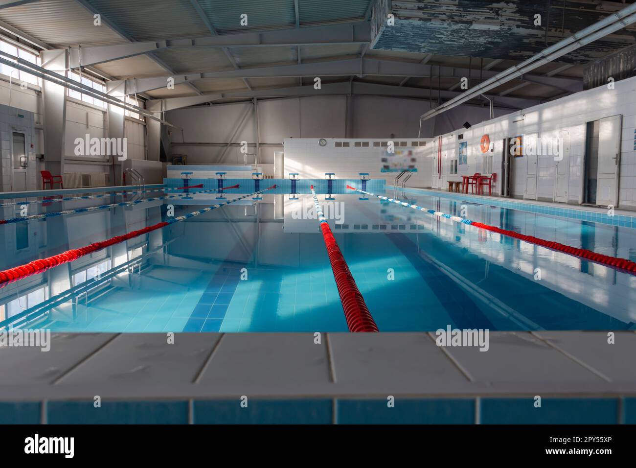 A large swimming pool with clear blue water in the hotel for relaxation ...