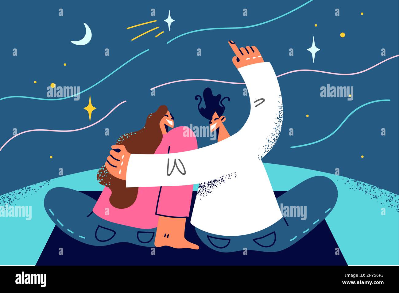 Happy couple sit on blanket in nature looking at stars at night ...