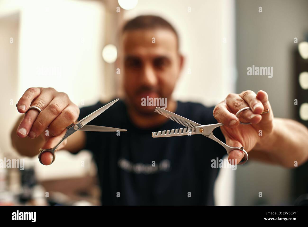 barber hand testing the sharpness of blade Stock Photo - Alamy