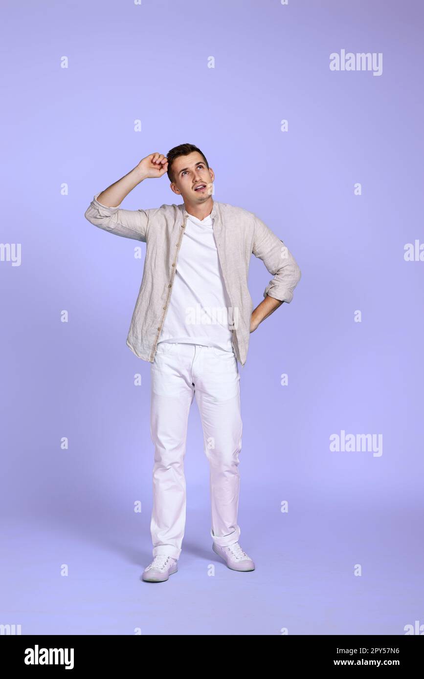 positive dreamy thoughtful young handsome man thinking Stock Photo - Alamy