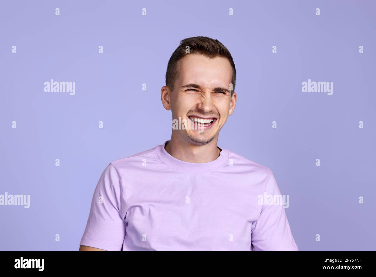 positive handsome man smiling on studio background Stock Photo - Alamy positive handsome man smiling on studio background Stock Photo - Alamy