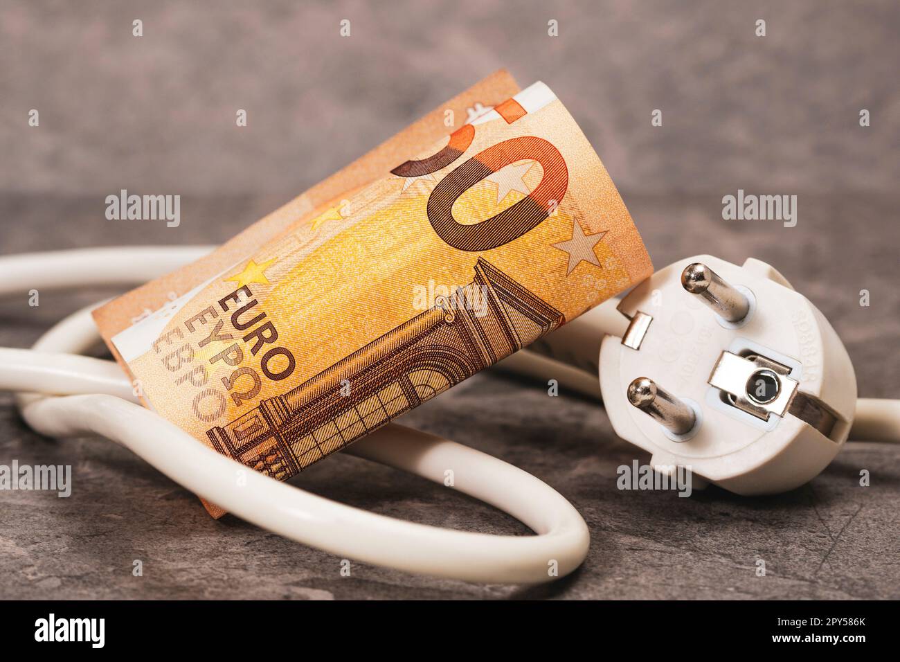 White electric plug and fifty euro close-up Stock Photo - Alamy