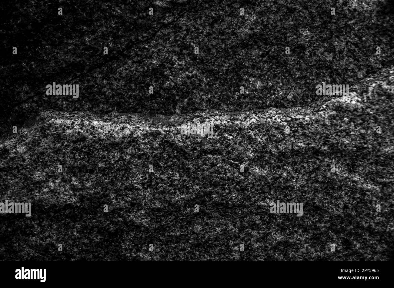 Rock texture. The surface of the stone is like a wall. White gray ...