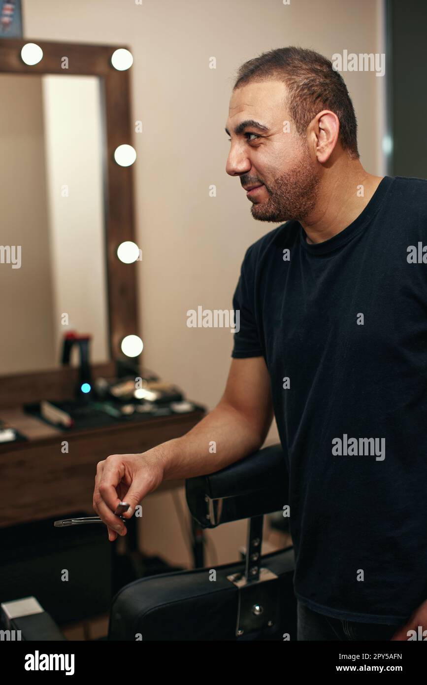 Barber with shaving tools in barber shop Stock Photo - Alamy