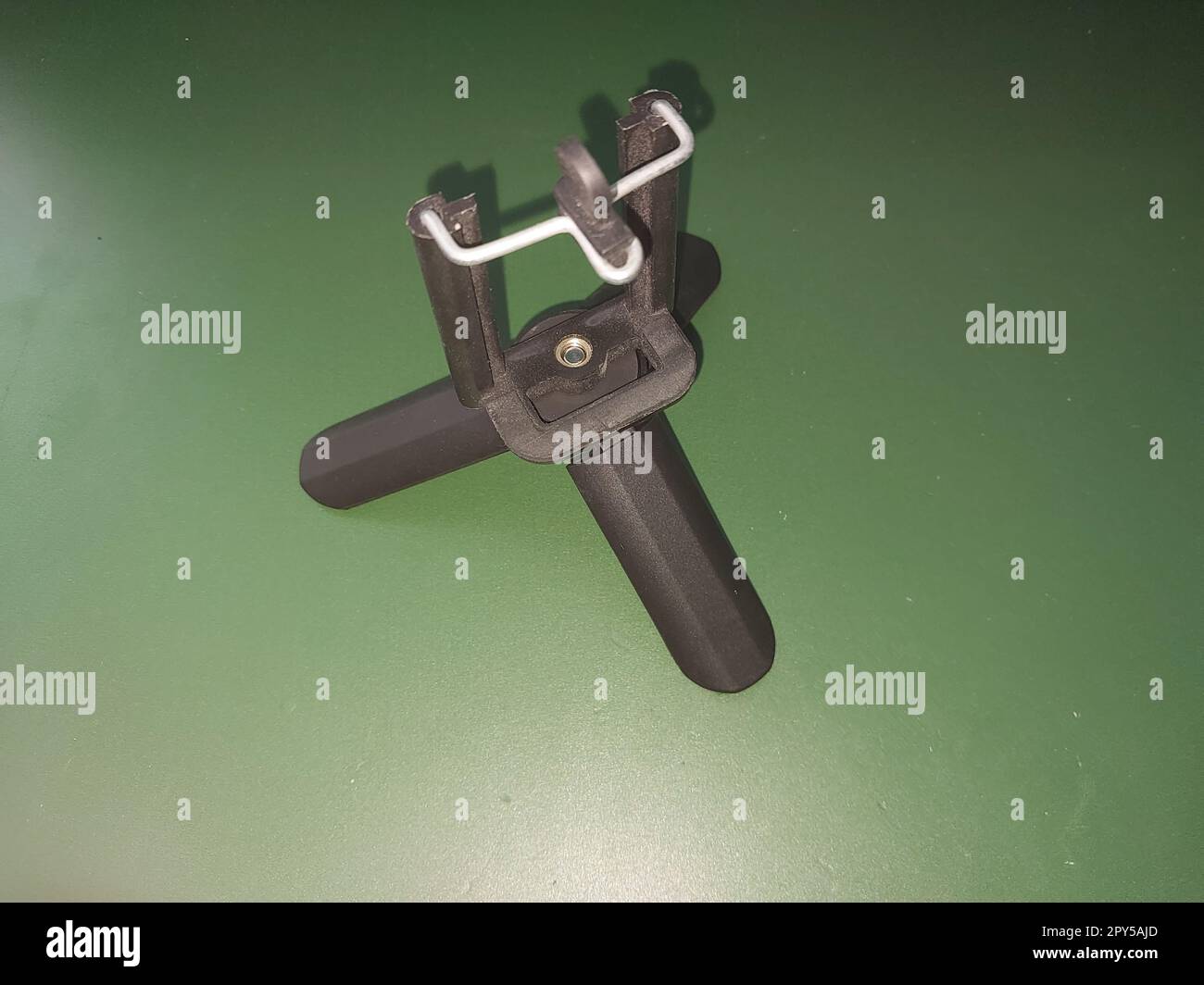 Simple smartphone tripod black plastic tripod Stock Photo - Alamy