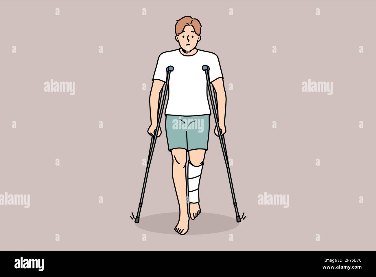 Unhappy young man with leg injury walking on crutches. Upset injured ...
