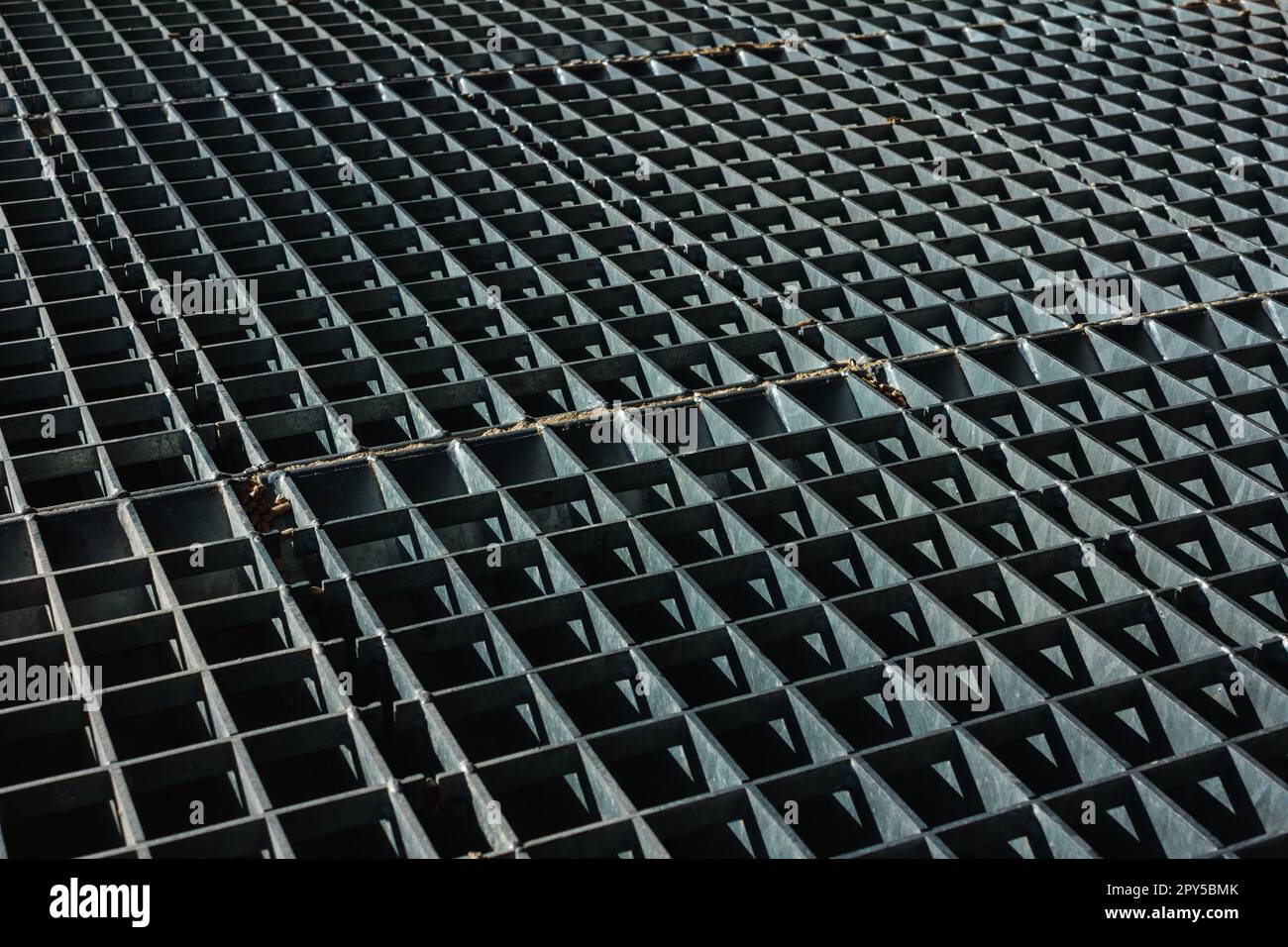 Closeup of heavy weight steel grating Stock Photo - Alamy