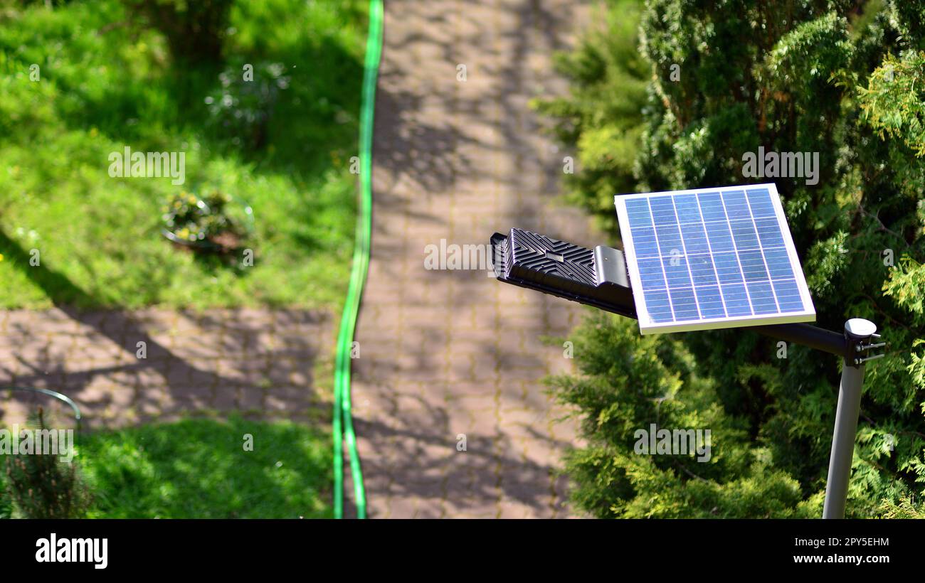 Lighting pole with photovoltaic panel and LED lamp lights with green ...