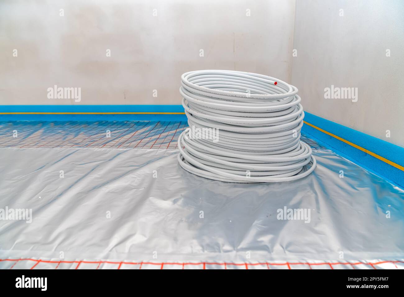 roll with pipe for underfloor heating in a new building Stock Photo - Alamy