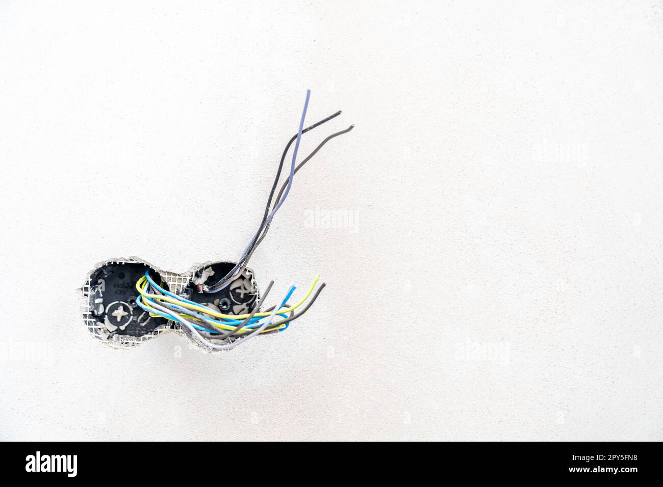 holes and wires in the wall for sockets and switches Stock Photo - Alamy