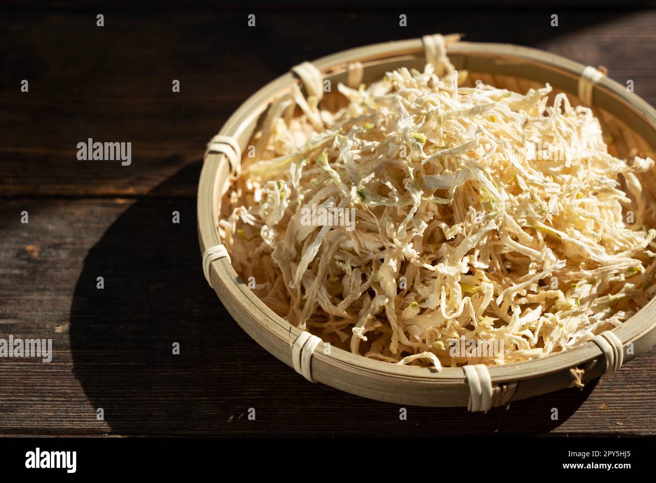 Kiriboshi-daikon (dried daikon) placed against a background of trees in ...