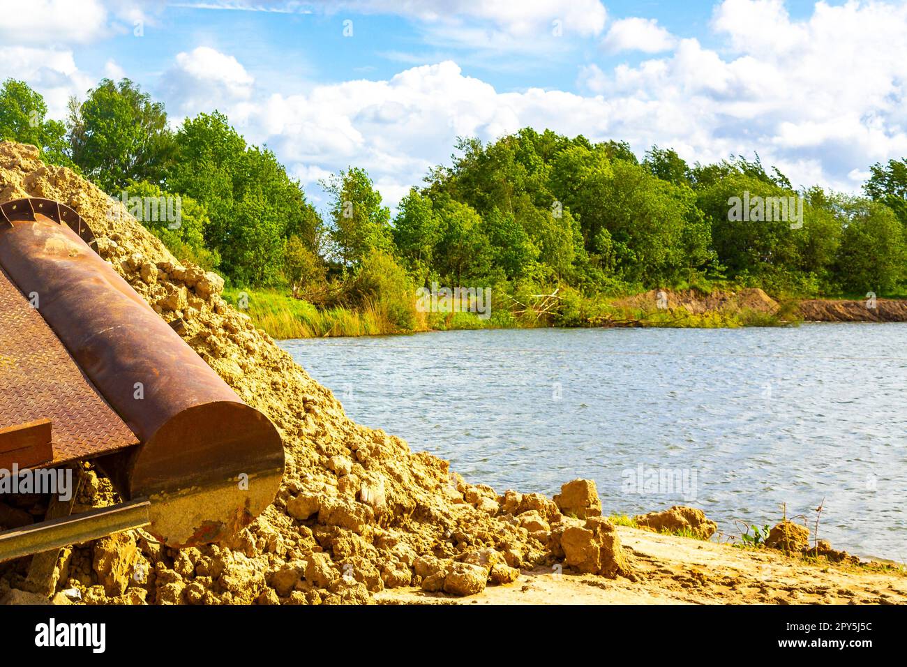 Quarry pond Nesse used as construction site and beach Germany Stock ...