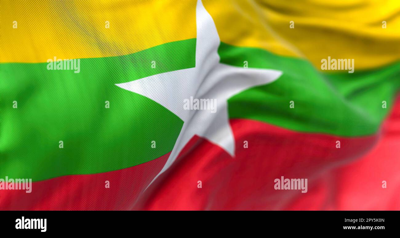 Detail of the Myanmar national flag fluttering. Flag has horizontal ...